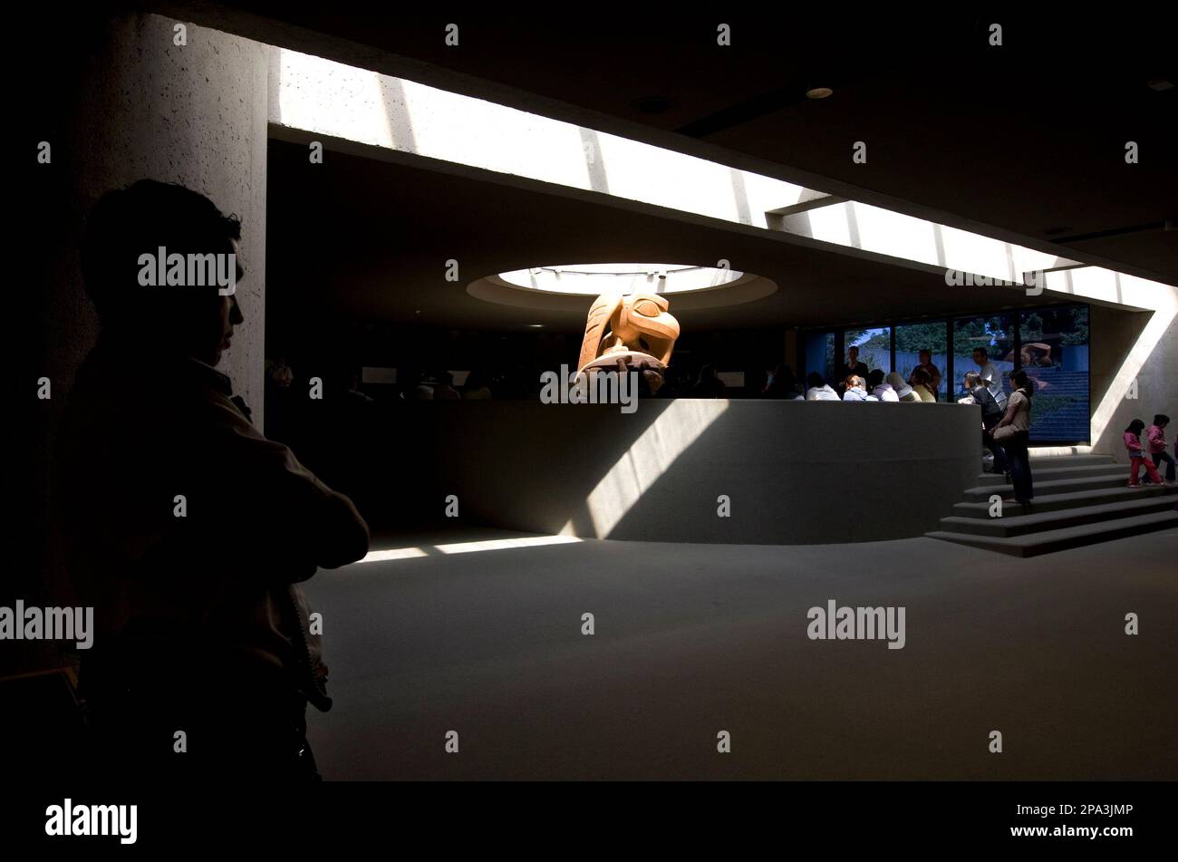 A museum security guard watches over the Bill Reid display at the ...