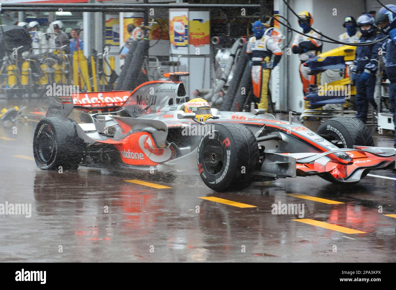 McLaren Mercedes driver Lewis Hamilton of Britain returns to the pits ...