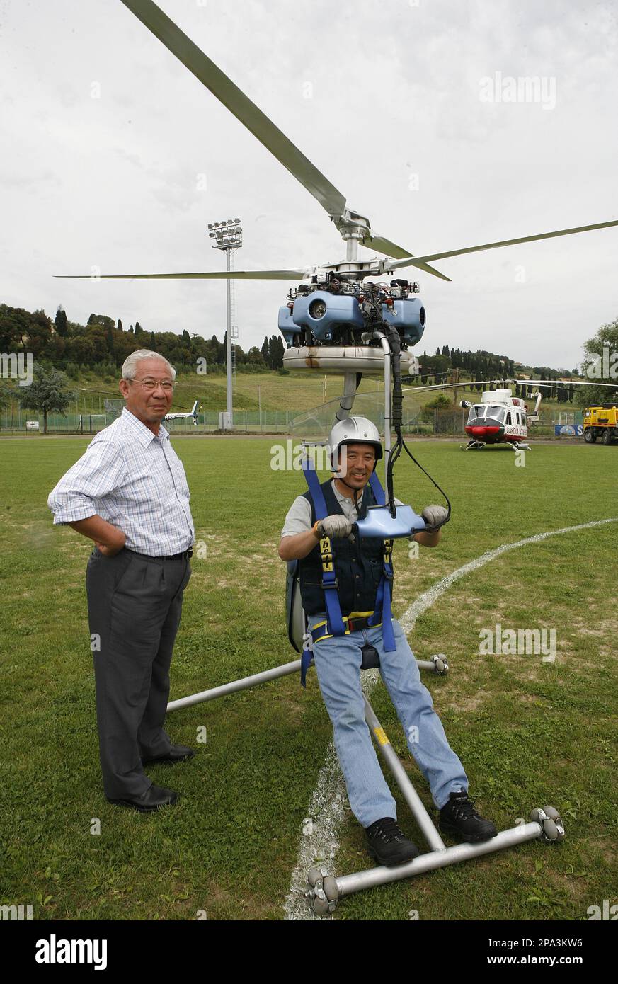 Gennai Yanagisawa, 75, of Japan, left, looks on as Gen Corporation ...
