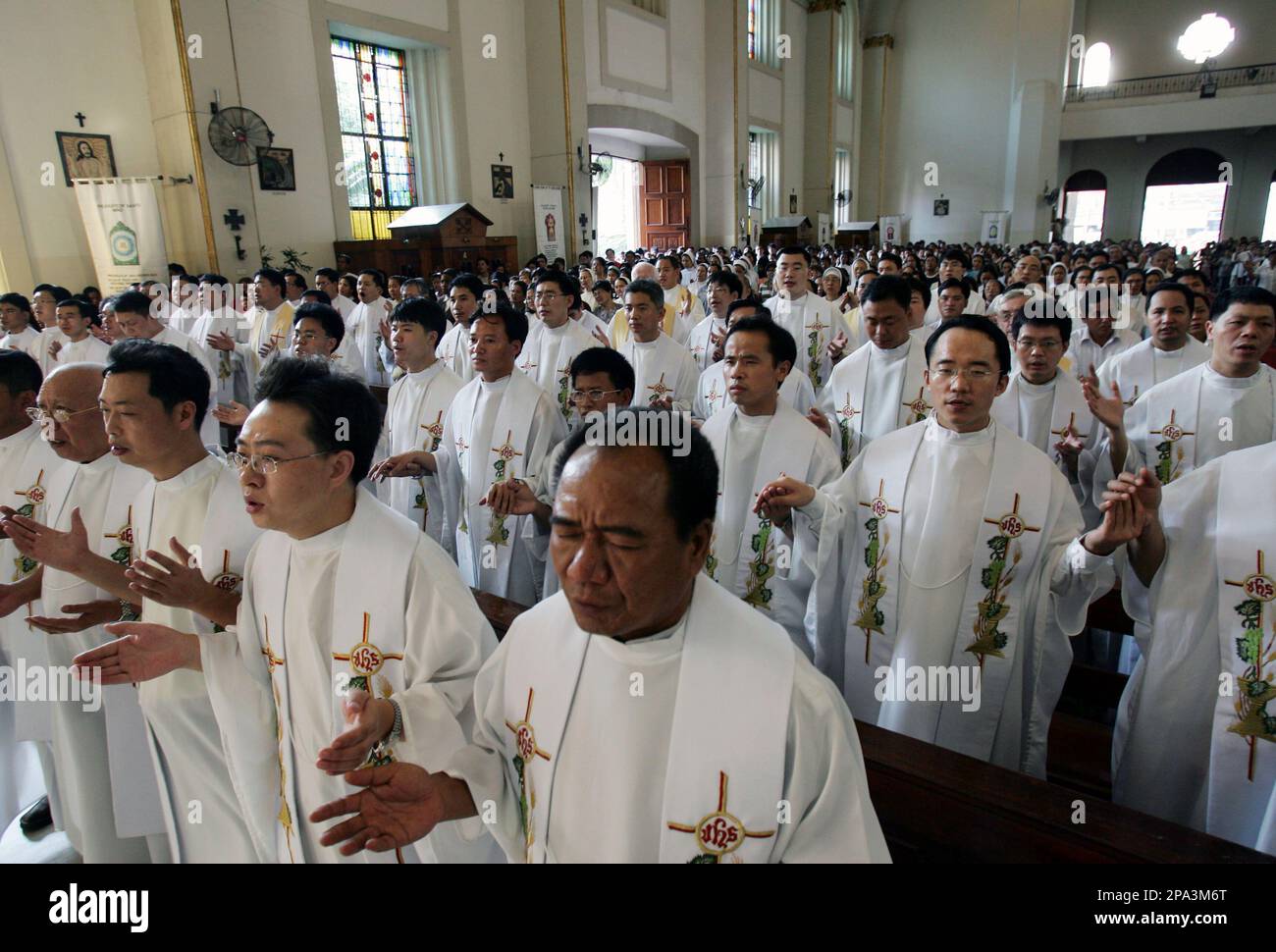 Chinese and Myanmar Catholic priests join a solidarity mass presided by ...