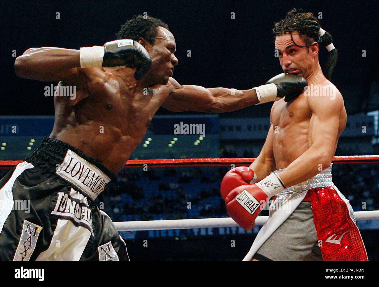 American boxer Paul Malignaggi, right, takes a punch from Lovemore N ...