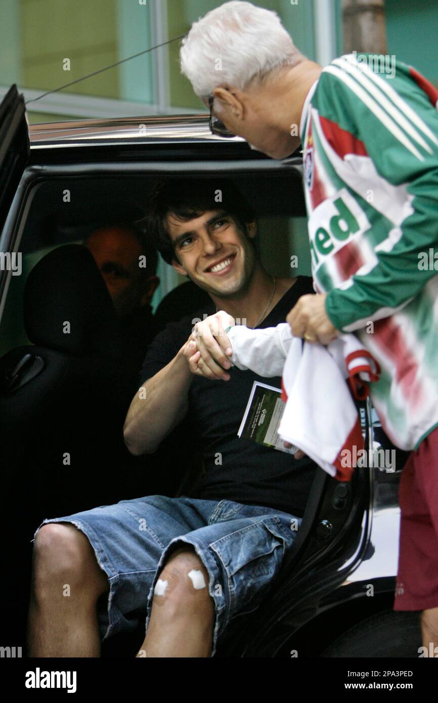 AC Milan's Kaka of Brazil shakes hands with a fan as he leaves the ...