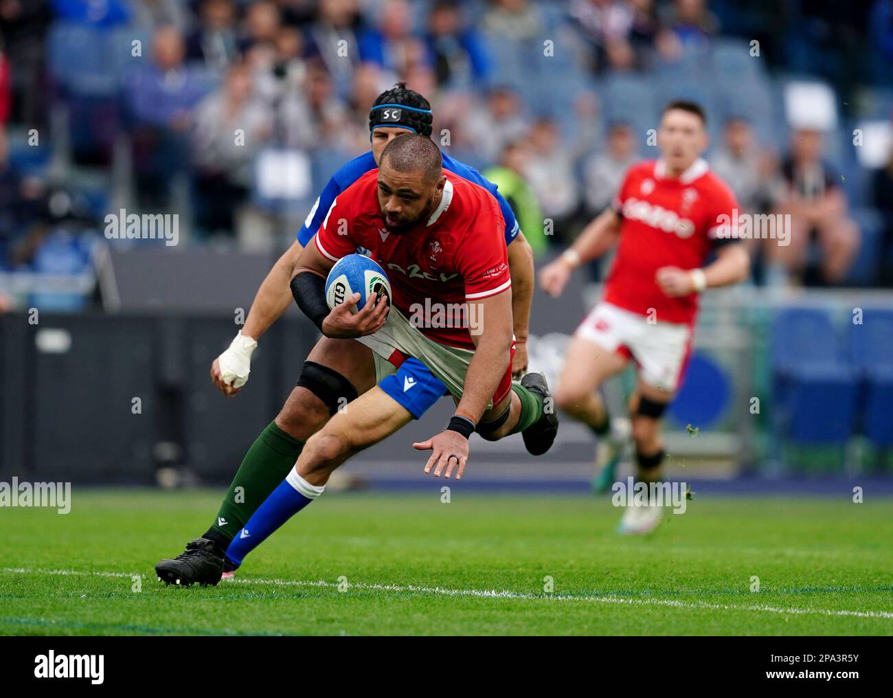 Wales' Taulupe Faletau runs in to scores his sides fourth try of the ...
