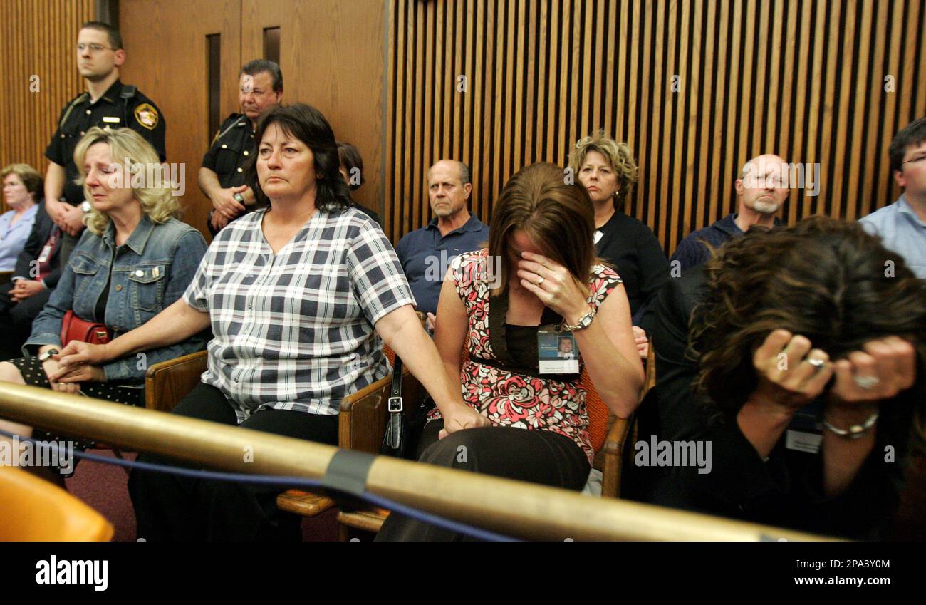 Becky Pfeiffer, second from left, mother of shooting victim Bruce ...