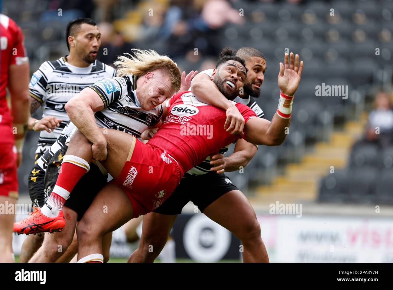 Hull FC's Brad Fash tackles SSalford Red Devils Kallum Watkins during ...
