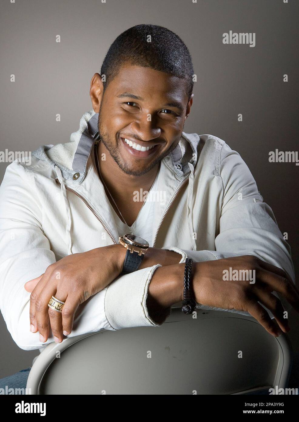 Singer Usher poses for photographs in his dressing room before ...