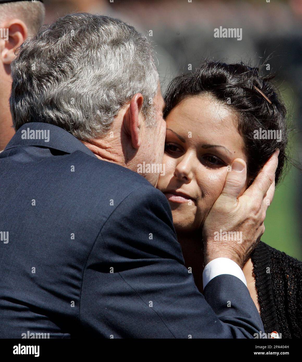 President Bush kisses Erika Wyckoff, who's husband Sgt. Charles Wyckoff ...