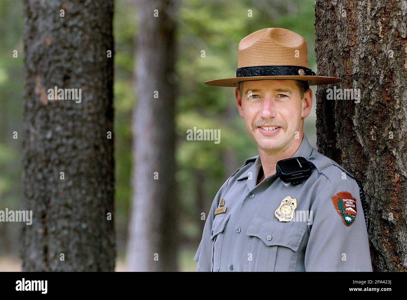 Glacier National Park ranger Gary Moses poses for a photo outside ...