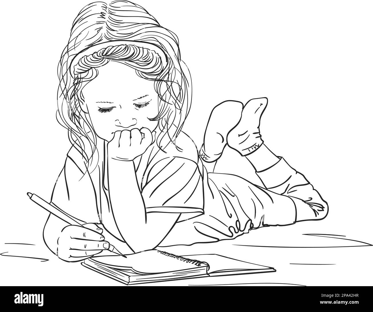 Child girl writing in note book while lying on floor with chin on hand ...