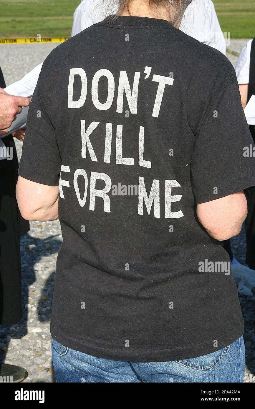 Death penalty opponent Sheila O'Flaherty wears a shirt in opposition to ...