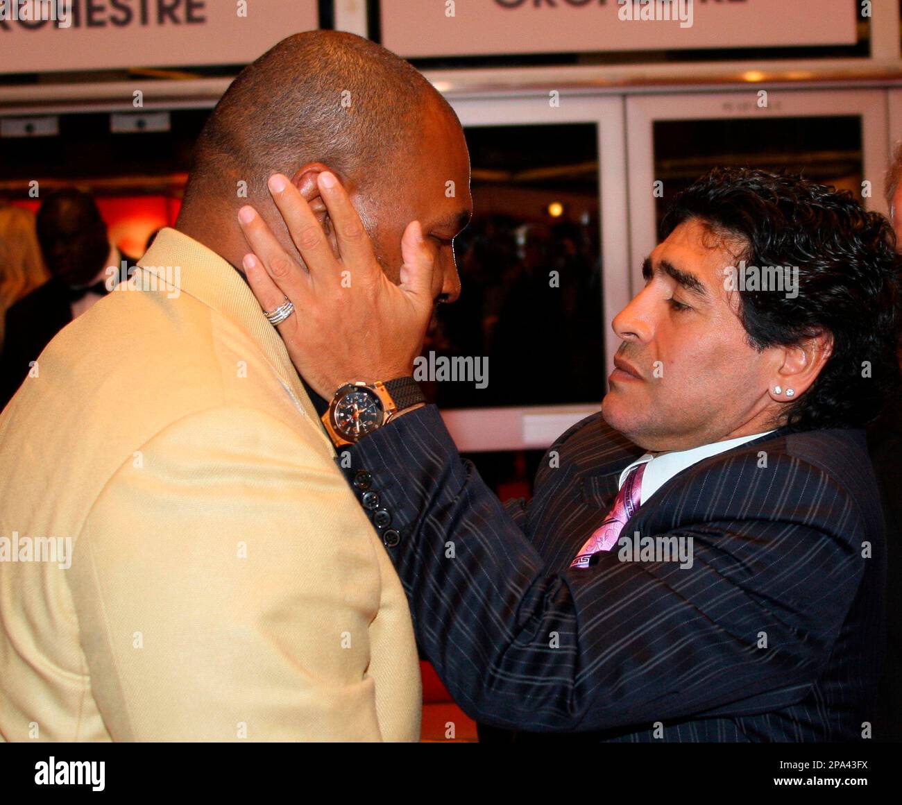 American boxer Mike Tyson, left, and former Argentinean soccer great ...