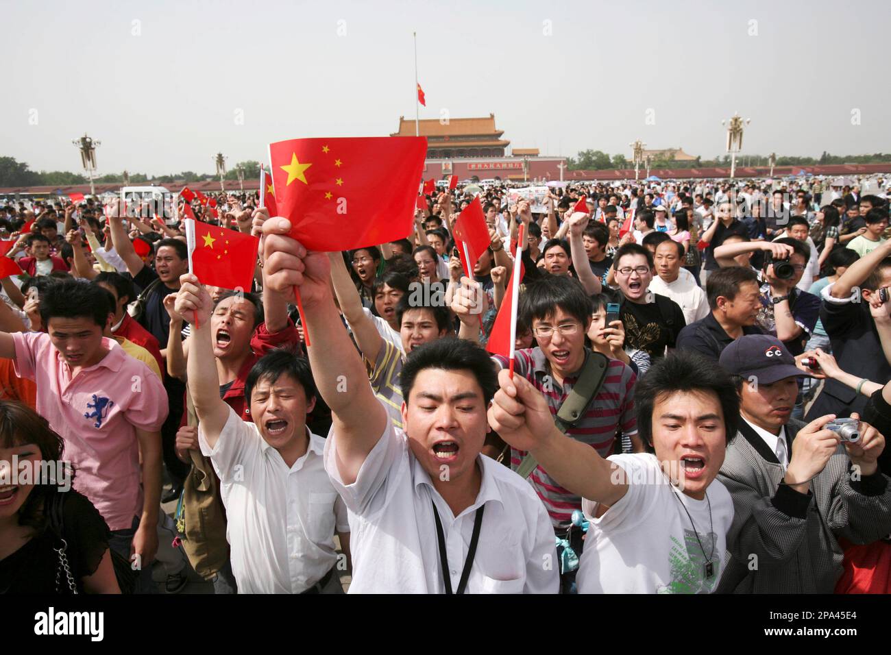 A large crowd shouts "Long Live China!" at Tiananmen Square following a ...