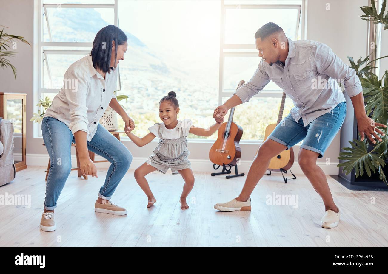 Family, dance and child with mom and dad having fun, bonding and ...