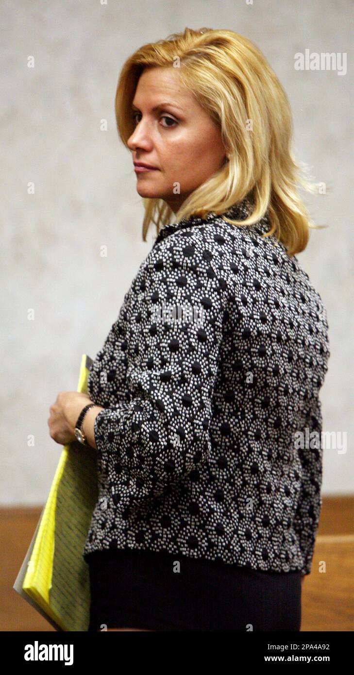 Dina Matos McGreevey looks across the court room as she leaves for a ...