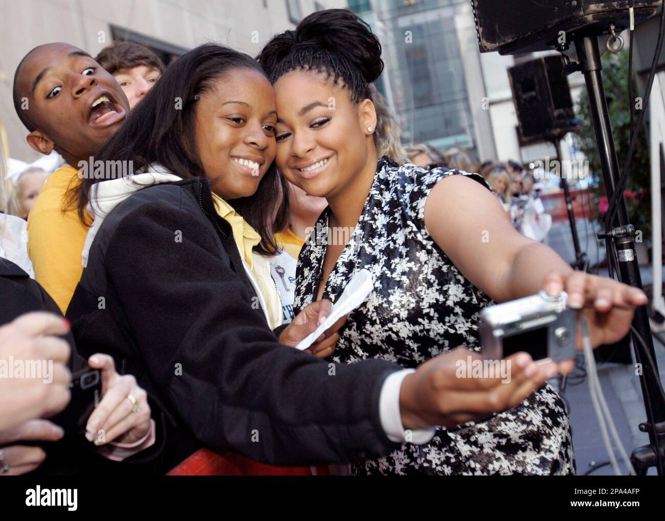 Actress Raven-Symone, right, poses for photos with the audience in New ...