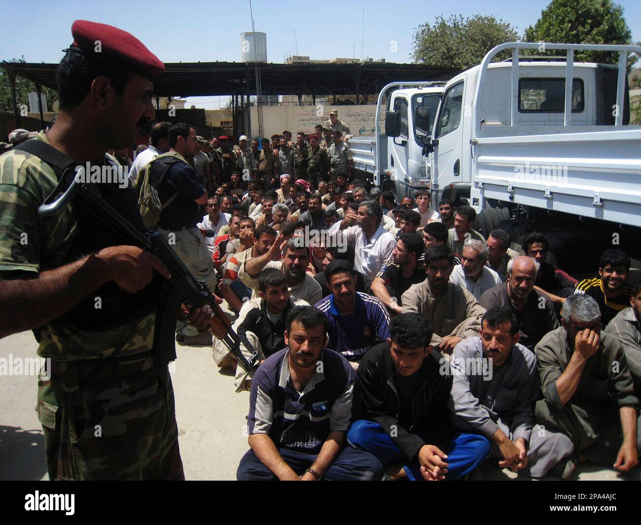 Detainees sit at an Iraqi army base in Mosul, Iraq, Monday, May 19 ...