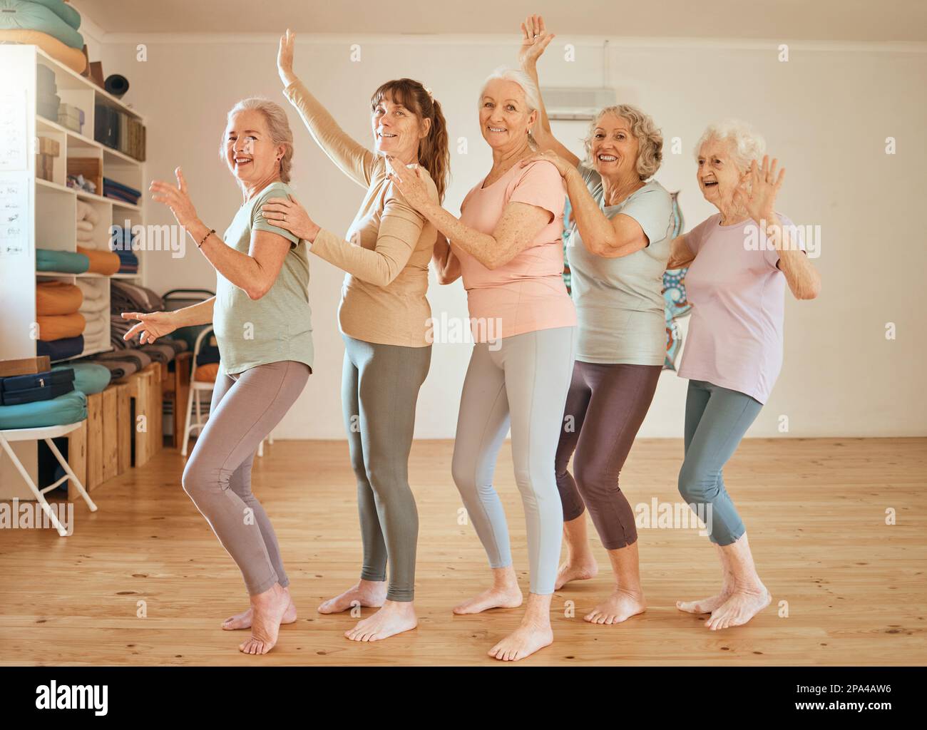 Elderly, yoga and portrait of friends row dance together on class break ...