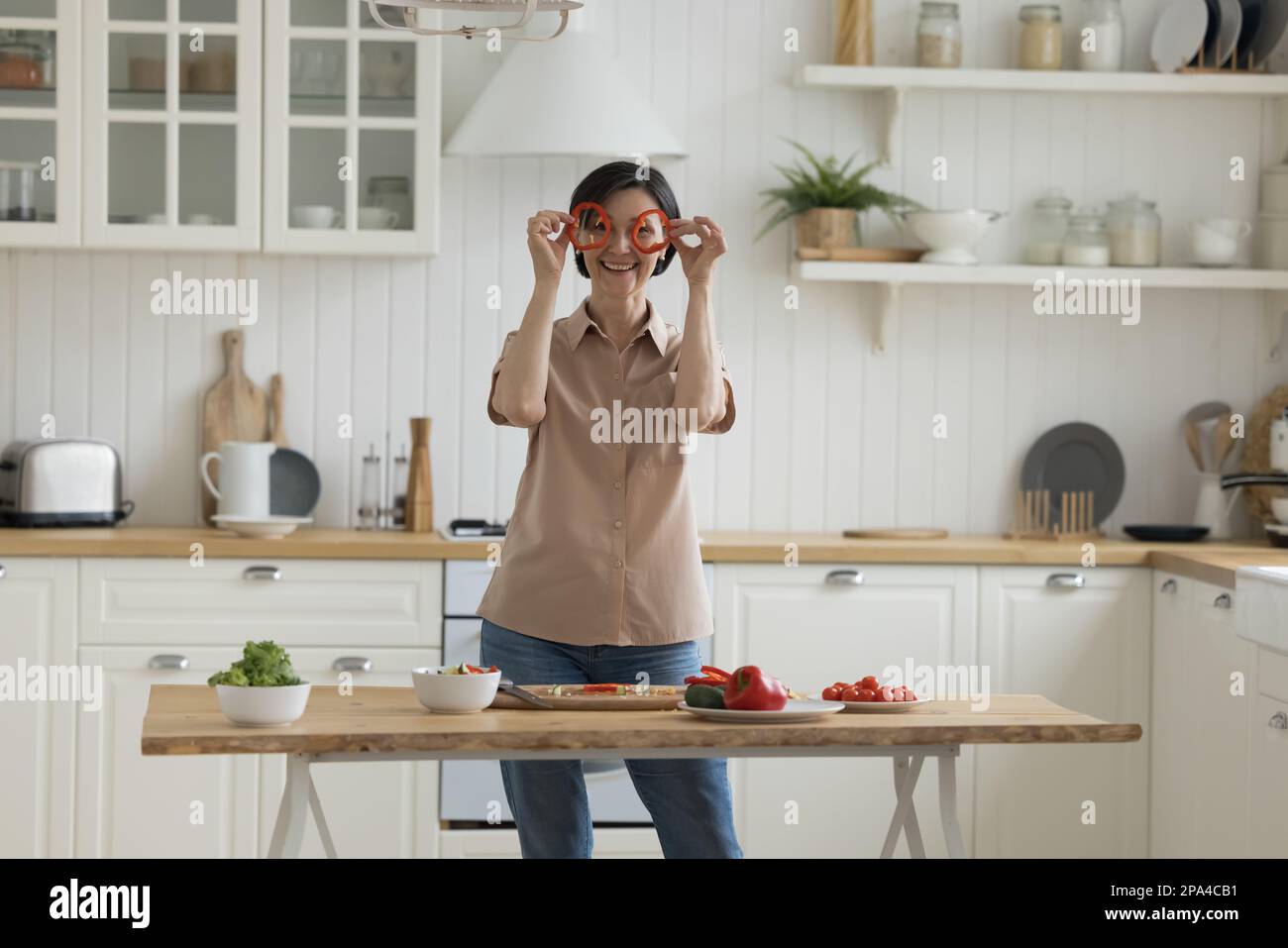 Mature woman cooking face on hi-res stock photography and images - Alamy