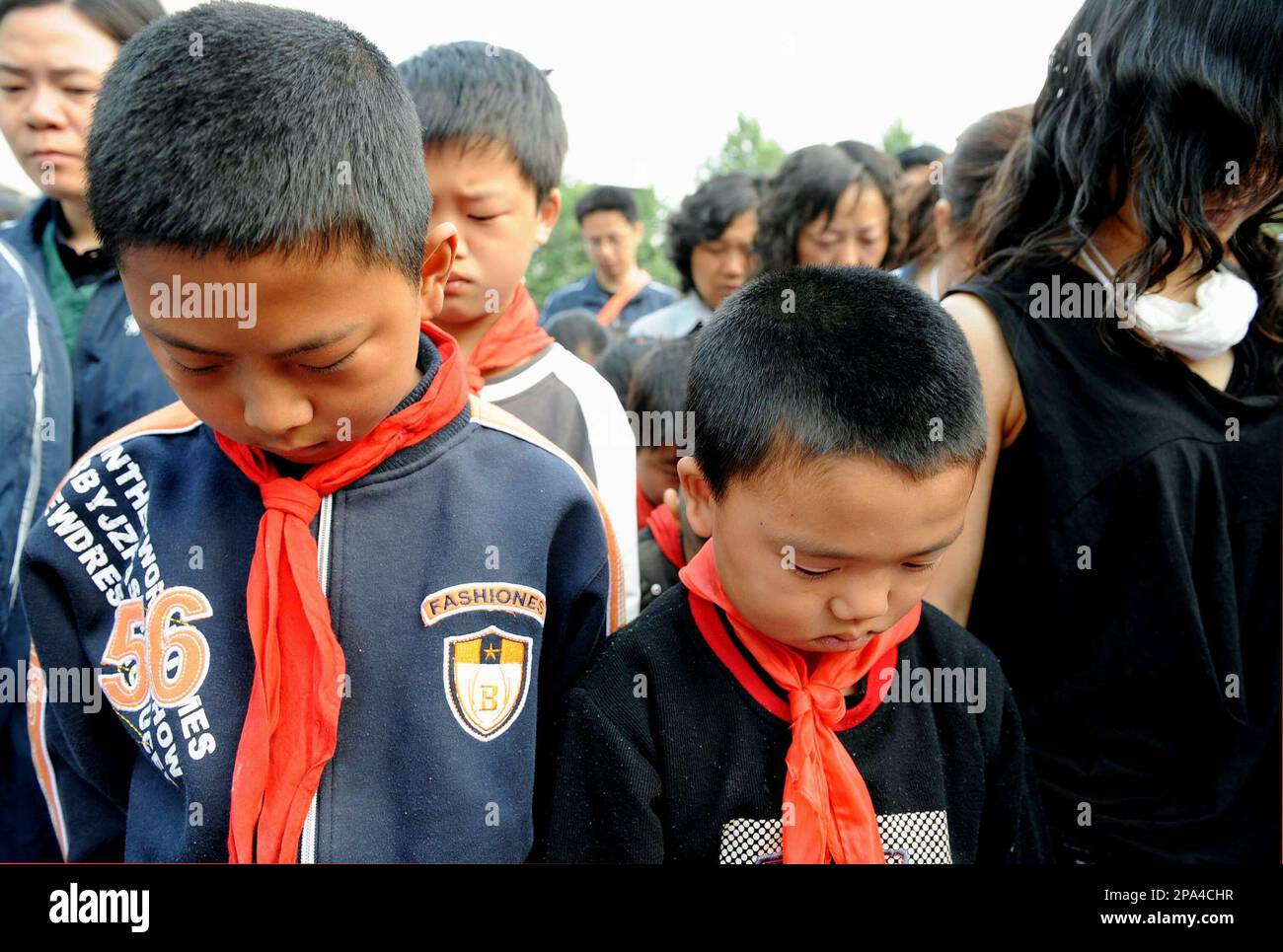 In this photo released by China's Xinhua News Agency, children attend a ...