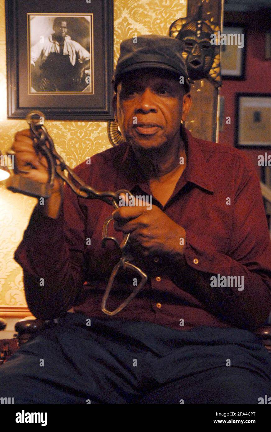 Local historian Richard Stewart holds a slave shackle in Petersburg, Va ...