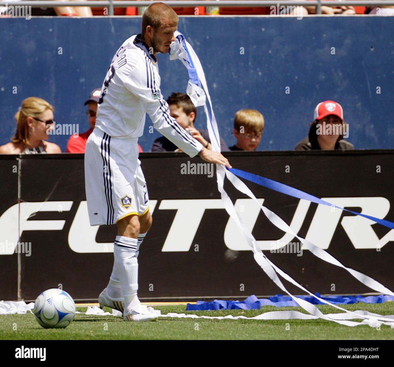 Los Angeles Galaxy midfielder David Beckham, of England, cleans up ...