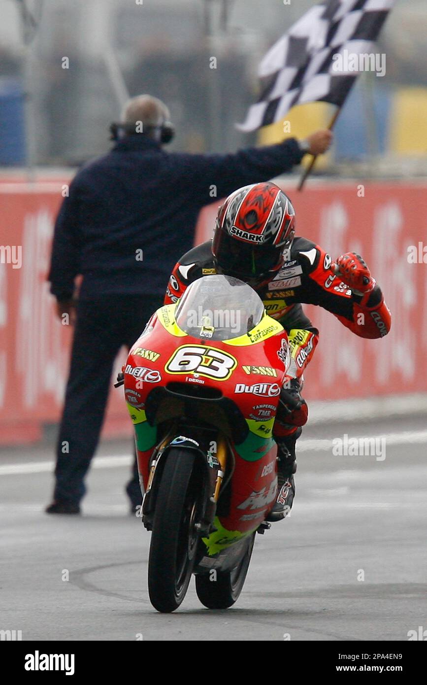 French 125cc rider Mike Di Meglio jubilates as he crosses the finish ...