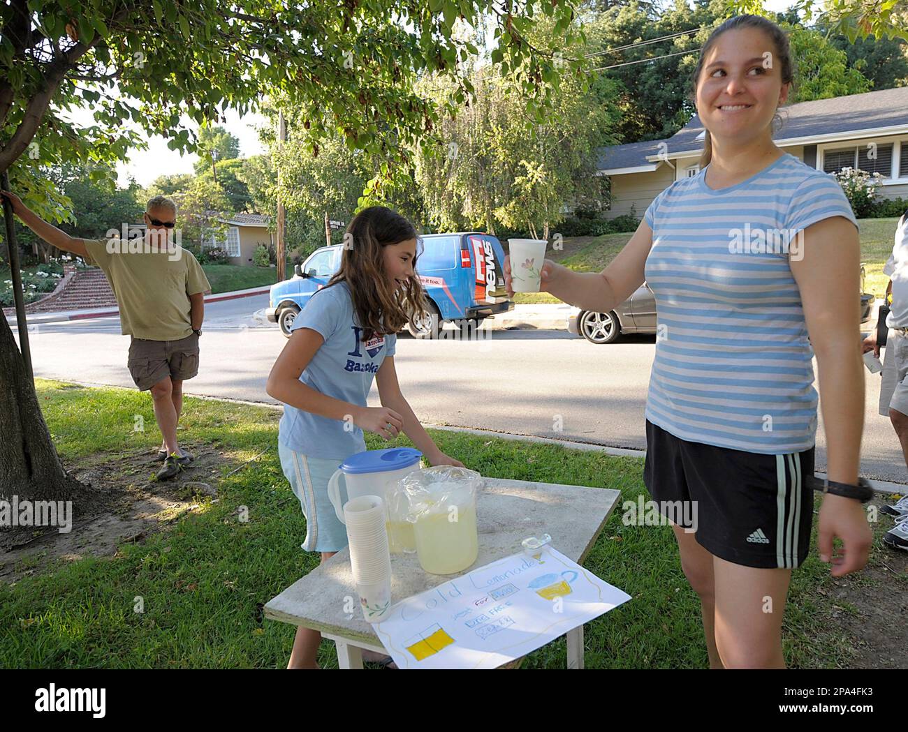 Jane Feinsod, center, with her father Ethan Feinsod, left, looking on ...