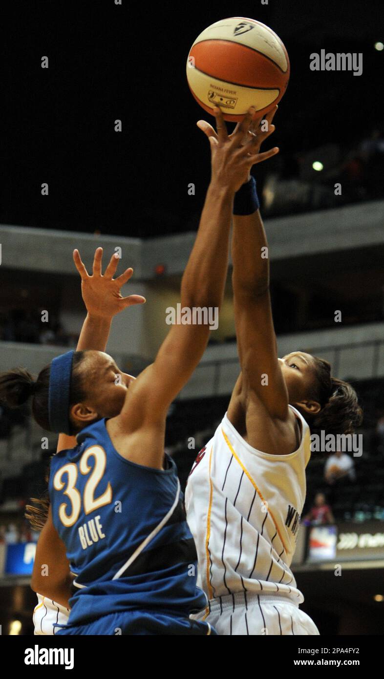 Indiana Fever defender Khadijah Whittington, right, stops a shot by ...