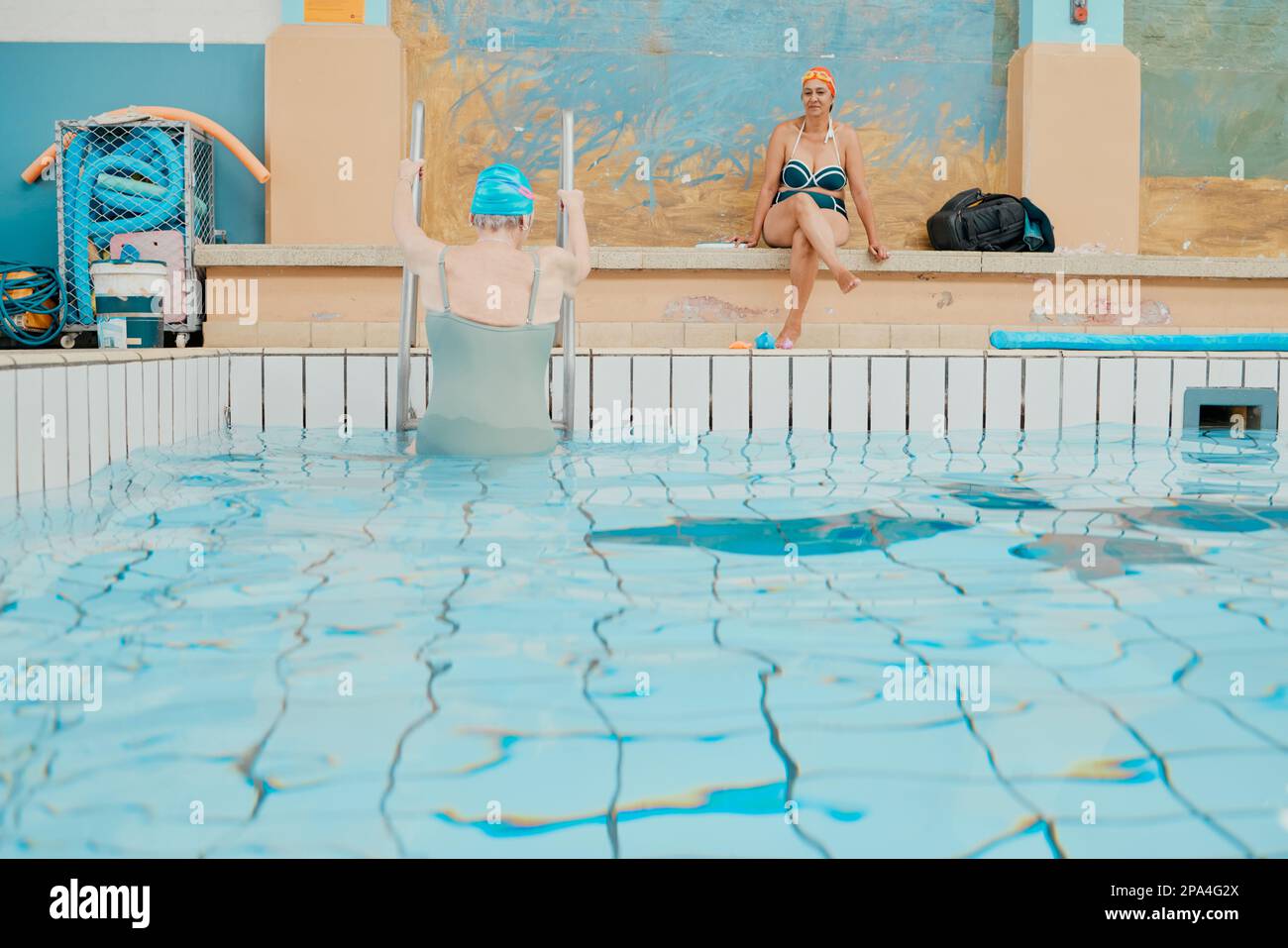 Swimmer, swimming pool and woman leaving water after fun swim, aquatic ...