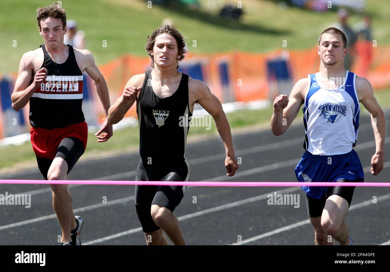 Brandon Pearce of Skyview, right, wins the 200 meter dash in front of ...