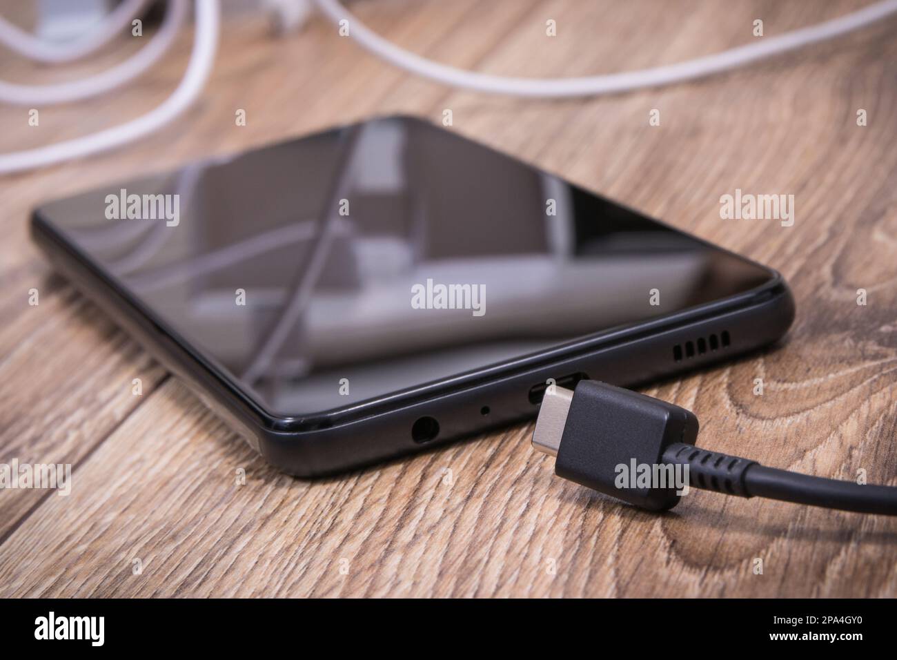 Smartphone and unconnected cable of charger. Mobile phone charging ...