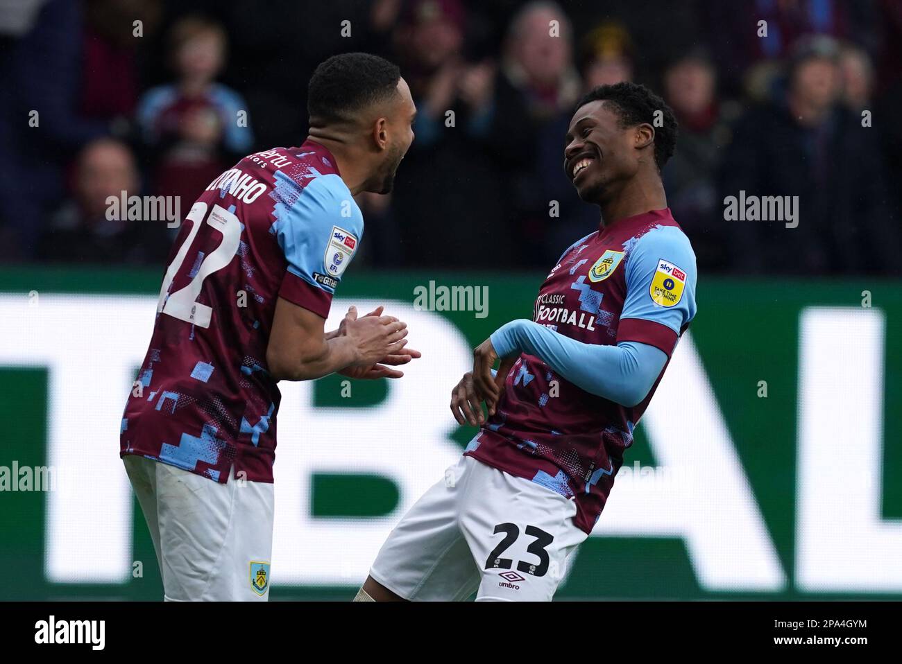 Burnley's nathan tella (right) celebrates scoring their side's second ...
