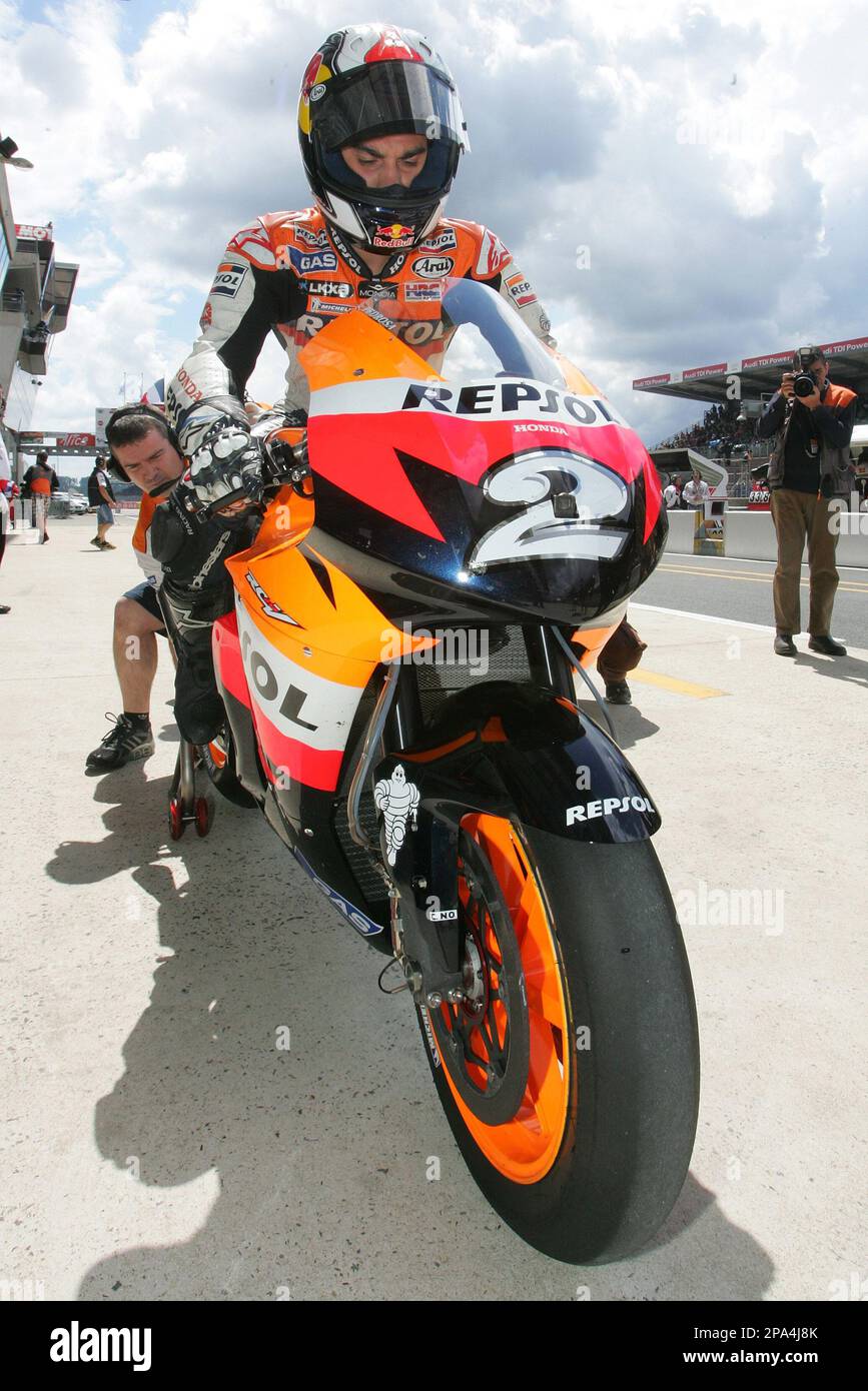 MotoGP rider Dani Pedrosa of Spain get out his stand before the last ...
