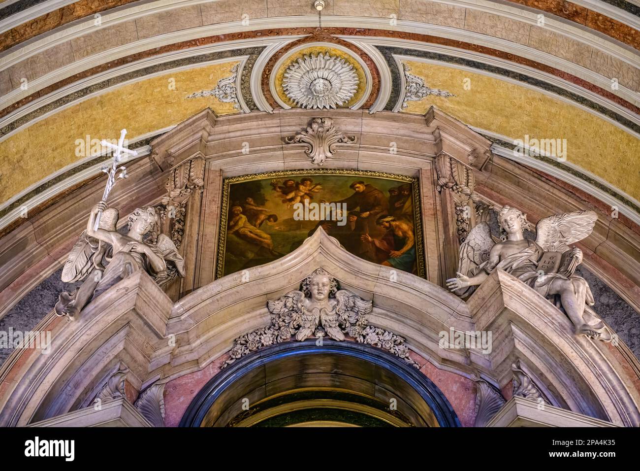 Piece of art painting on top of a door that is highly decorated with ...