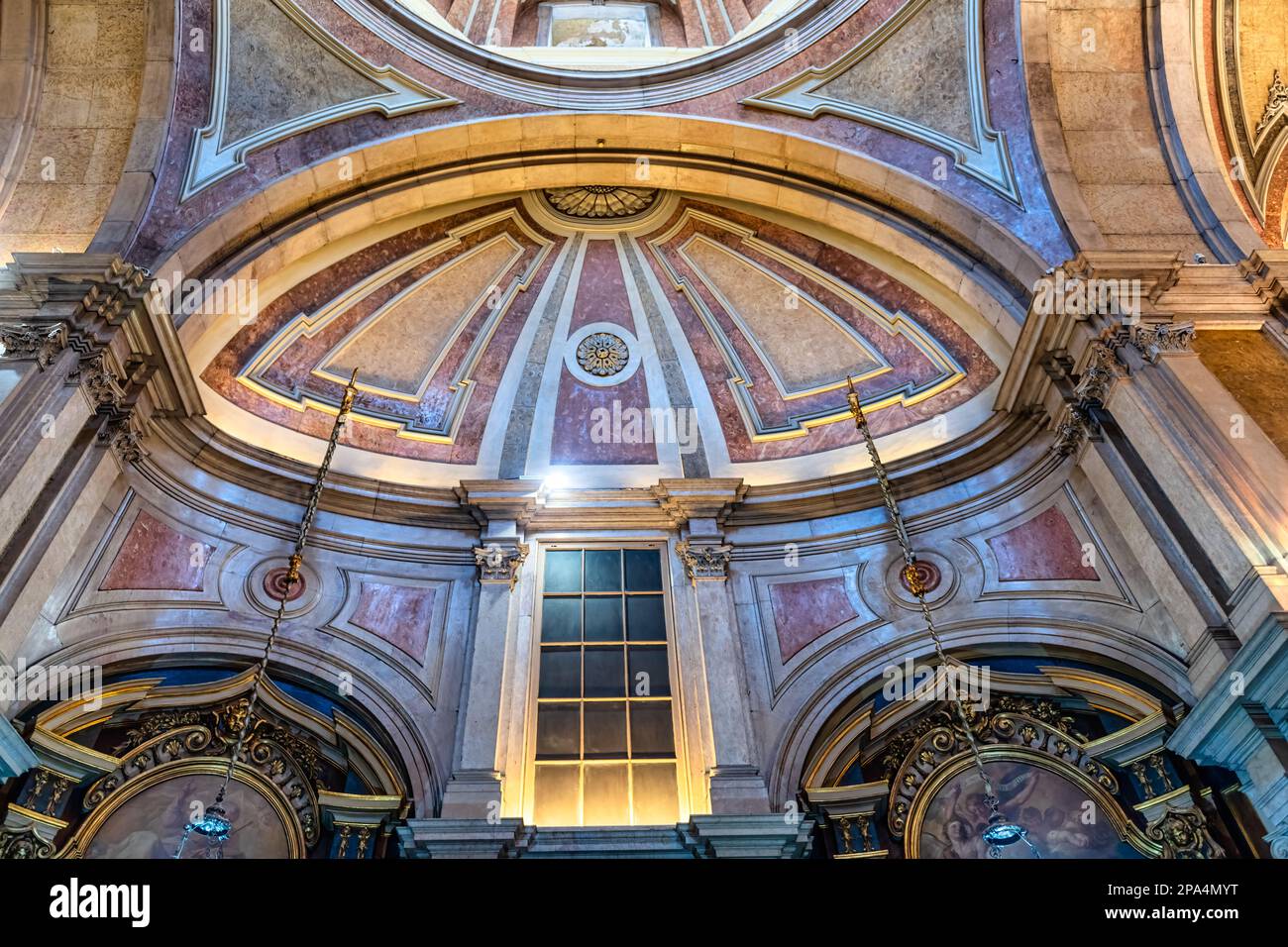 Wide-angle view of the cupola, arches, and a window inside of the ...