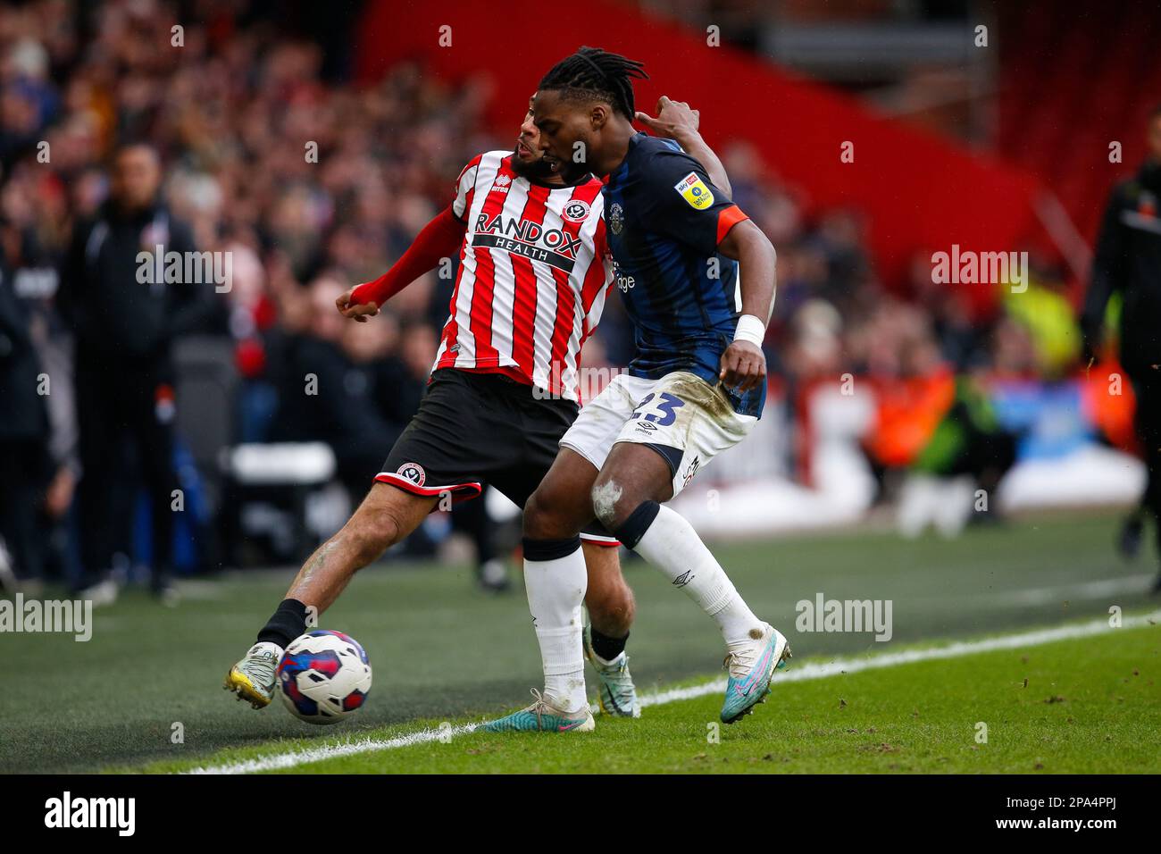 Jayden Bogle #20 of Sheffield United and Fred Onyedinma #23 of Luton ...