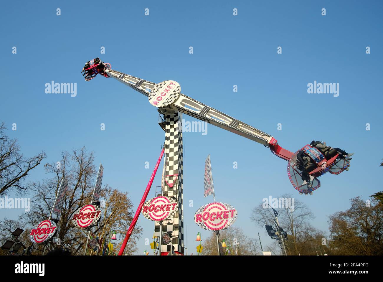 Peoples having fun with carousel rocket Amusement Park Ride at the Luna ...