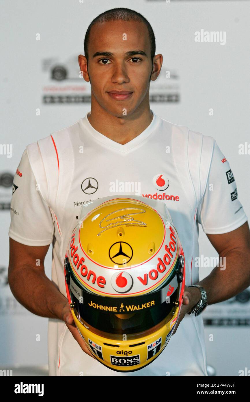 McLaren Mercedes F1 racing driver Lewis Hamilton poses with his ...