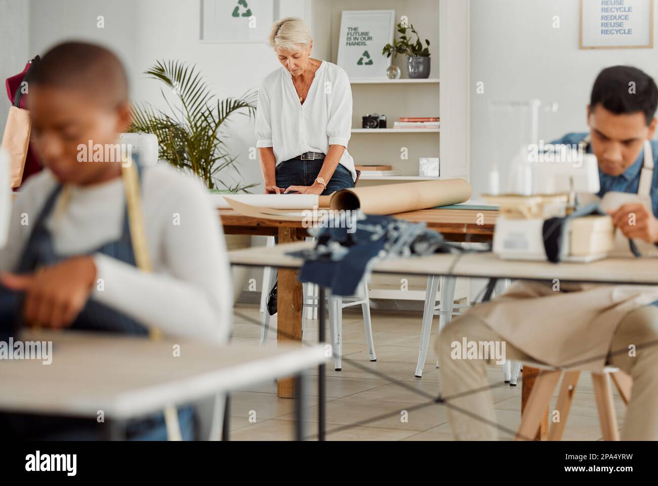 Fashion, design and style with young, diverse designers sewing stylish ...