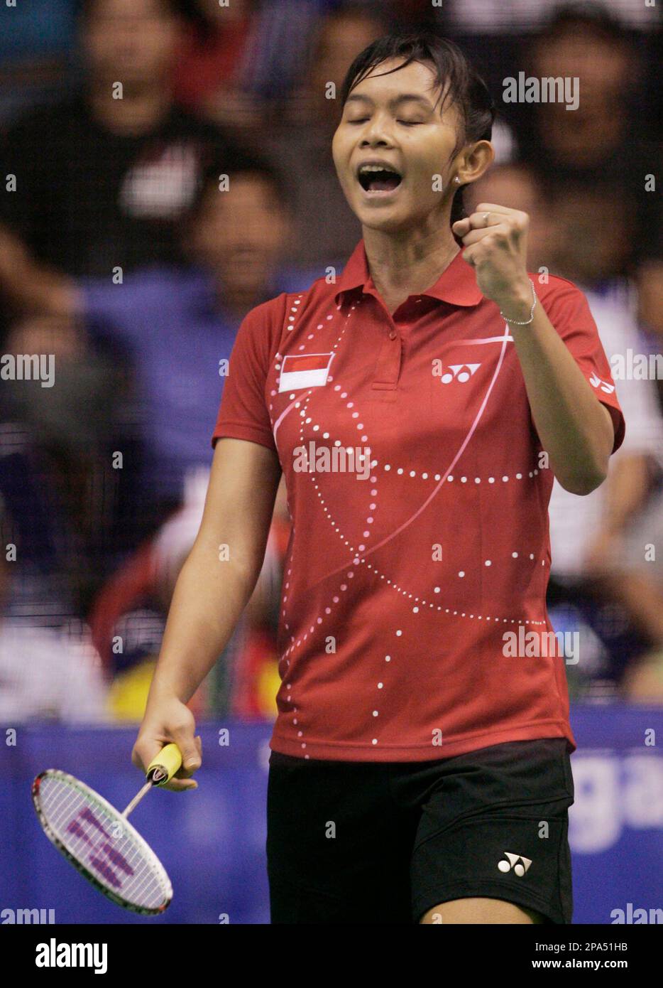 Indonesia's Maria Kristin reacts after defeating Hong Kong's Pui Yin ...