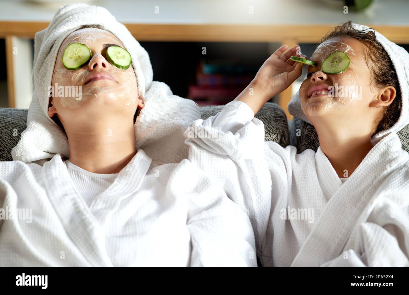 Happy, carefree and relaxed mother and daughter having a relaxing spa ...