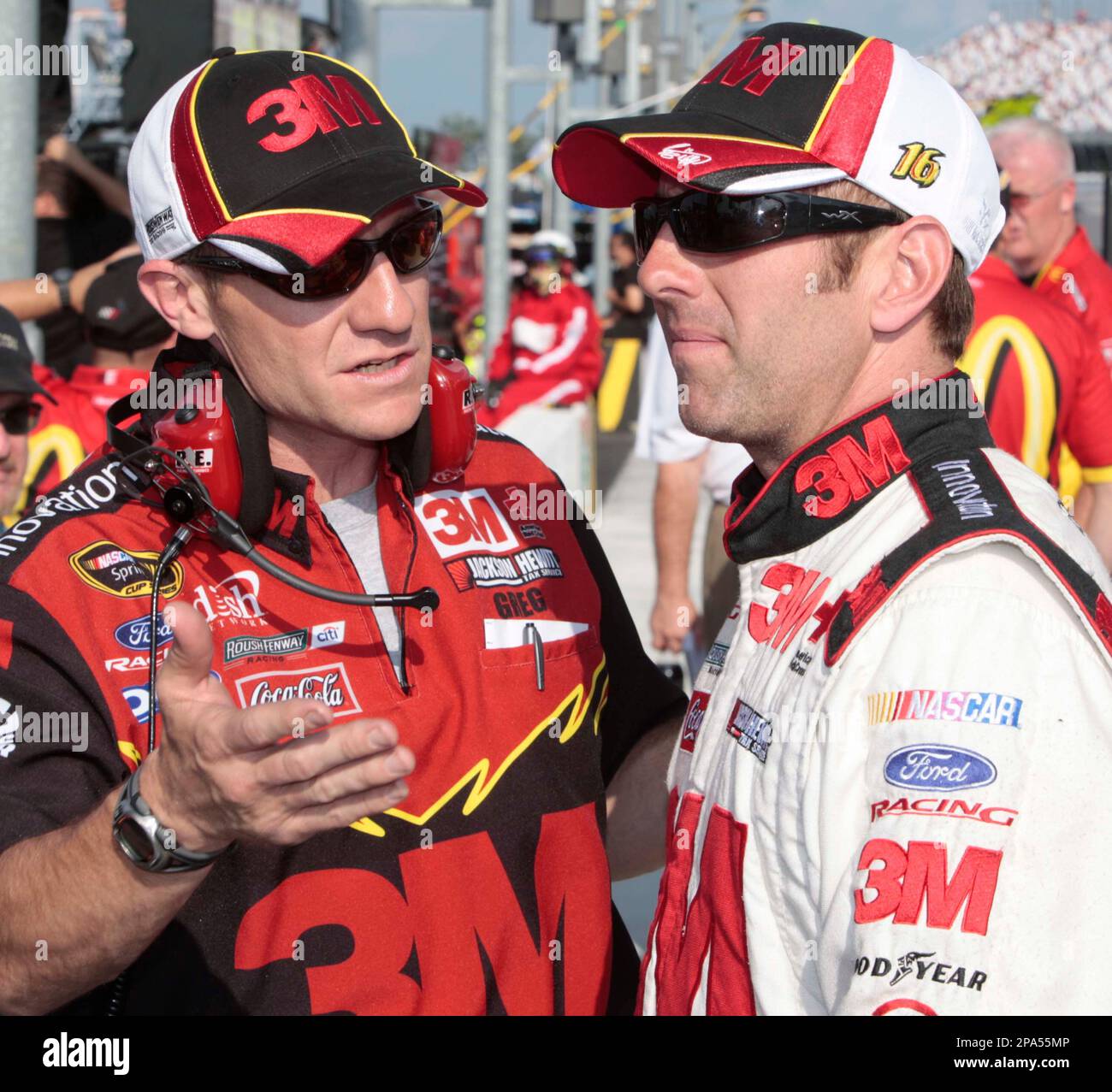 NASCAR driver Greg Biffle, right, talks to his crew chief Greg Erwin ...