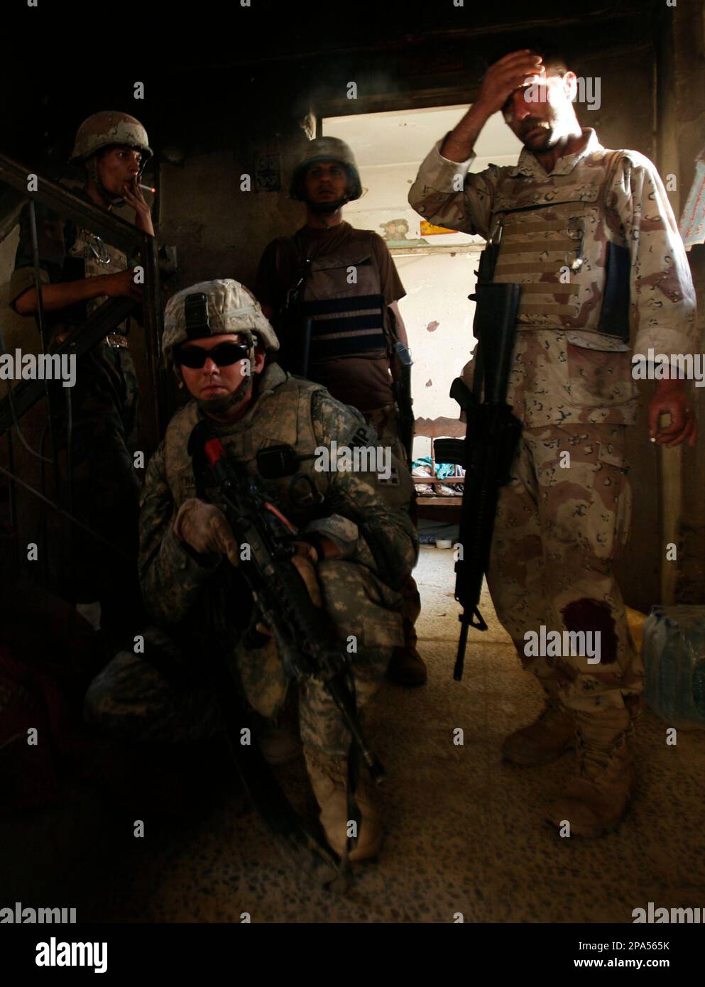 Iraqi Army soldiers and U.S. Army soldier from the 3rd Special Troops ...