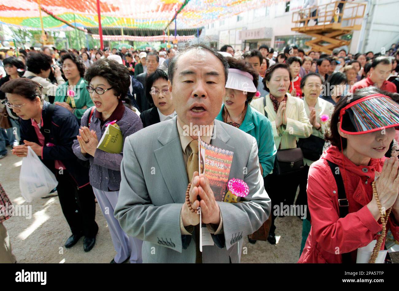 South Korean Buddhists pray during a service to celebrate the 2,552nd ... South Korean Buddhists pray during a service to celebrate the 2,552nd ...