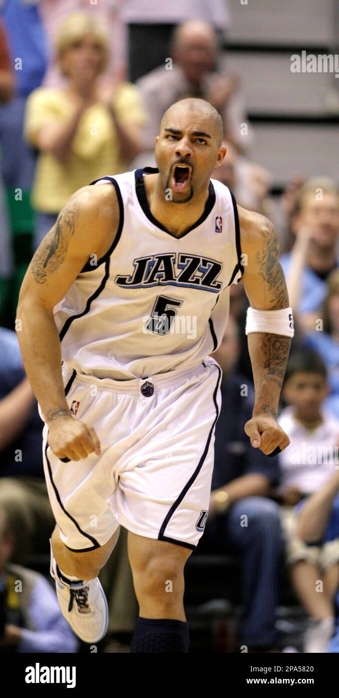 Utah Jazz forward Carlos Boozer (5) reacts to scoring against the Los ...