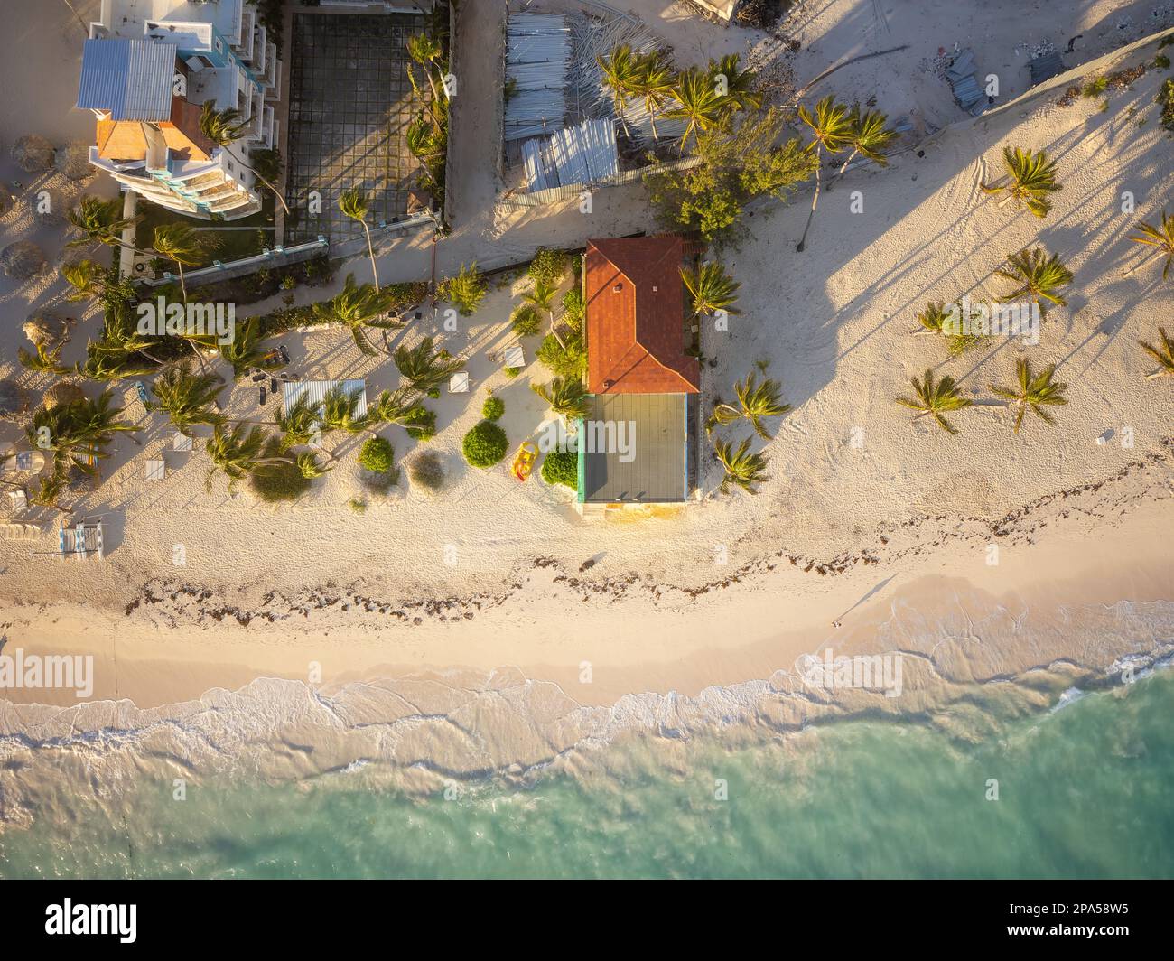 Aerial view. Sea coast. Waves of the warm sea beat against the sandy ...