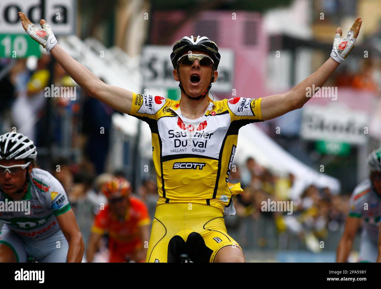 Italy's Riccardo Ricco' celebrates as he crosses the finish line to win ...