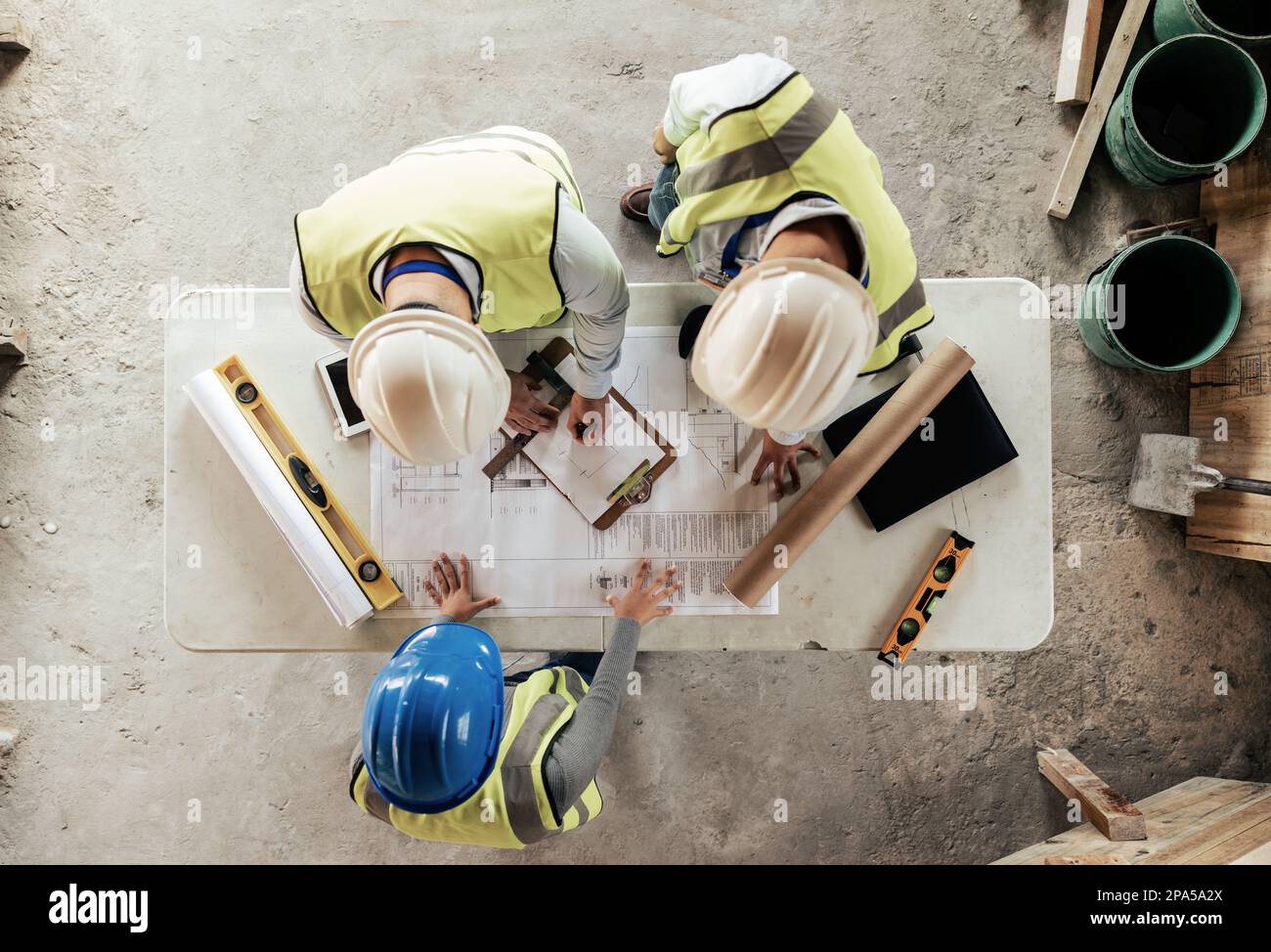 Architect, engineer and teamwork with blueprint from above on a ...