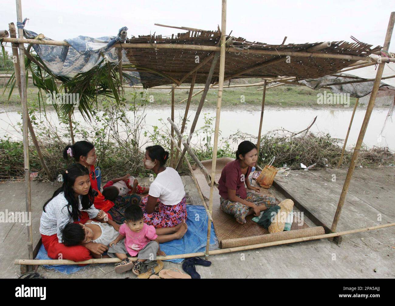 Myanmar family, who survived last week's destructive cyclone Nargis ...