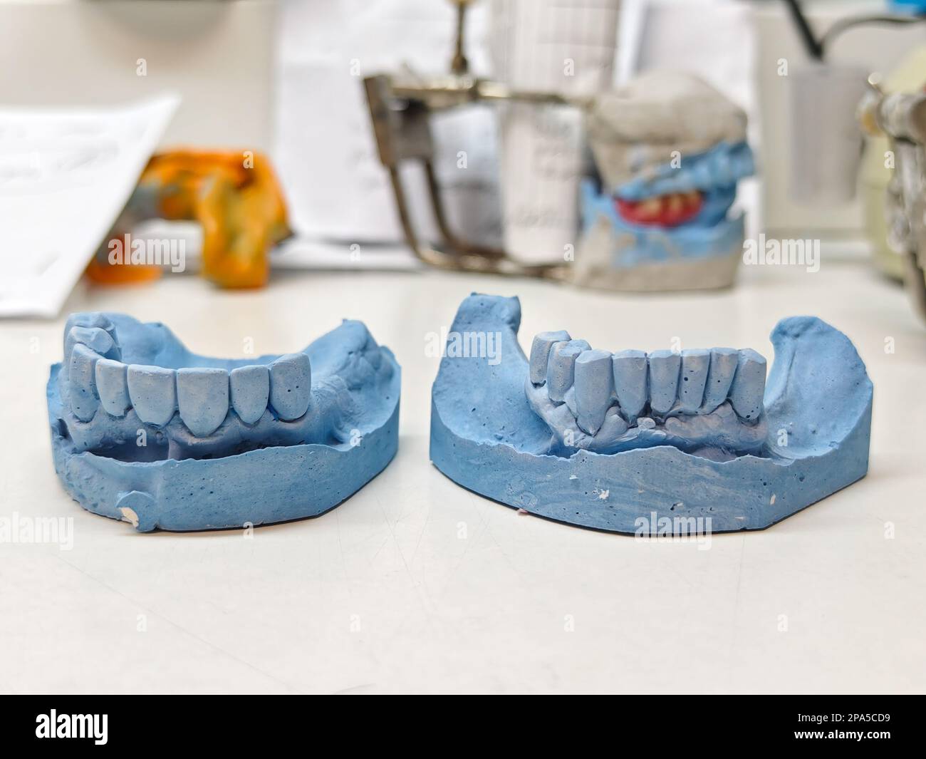 desktop of worker in dental laboratory with tools Stock Photo - Alamy